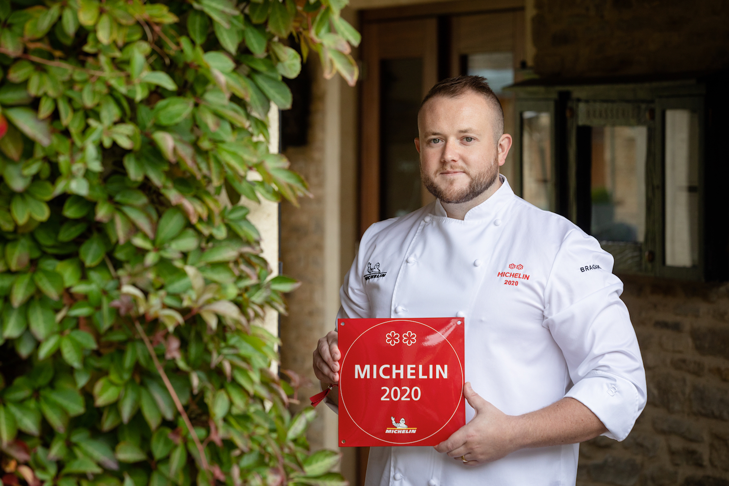 Niall Keating with the Michelin two-star plaque - Whatley Manor
